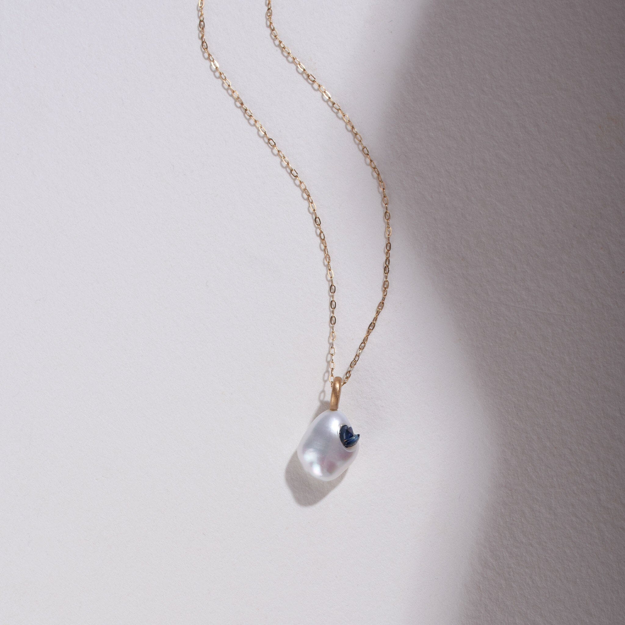 Piccolo Point Collection Freshwater Keshi Pearl Pendant with Blue Sapp ...